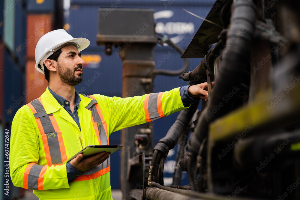 Portrait of a male engineer working in the shipping container industry ...