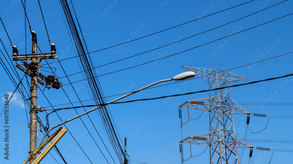 Electric wires and electric poles crossing the high voltage pole tower ...