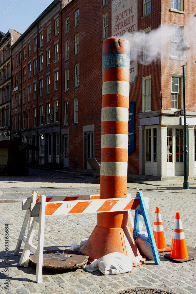 Steam venting from the street, utility pipe hot steam to building for ...