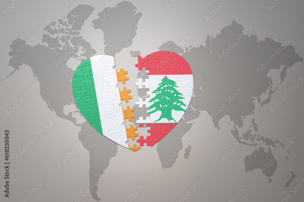 puzzle heart with the national flag of lebanon and ireland on a world ...