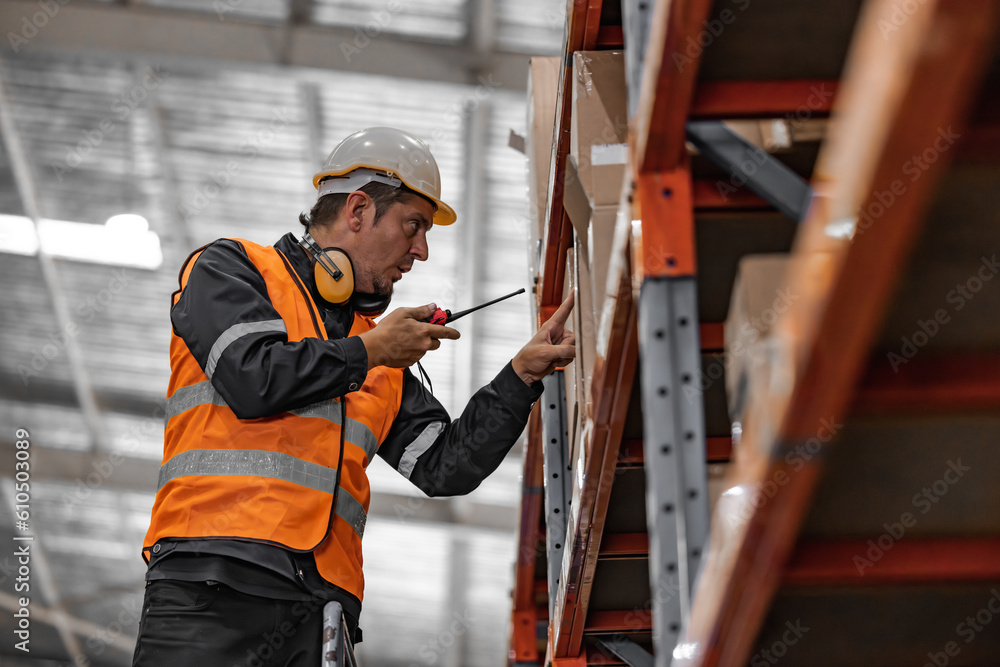 Warehouse supervisor uses two way radio for seamless communication and ...