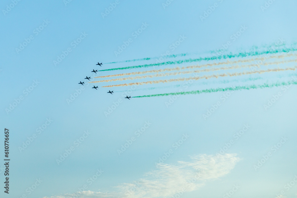 Fighter jets squadron with traces in Saudi Arabian national flag colors ...
