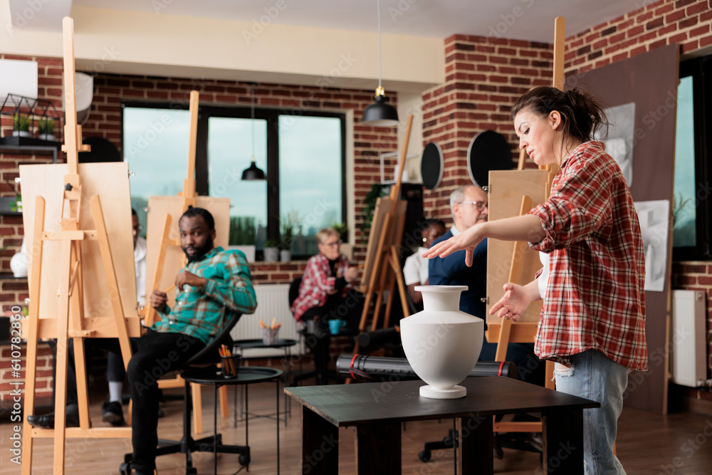 Young woman teacher having drawing lesson in art school, teaching ...