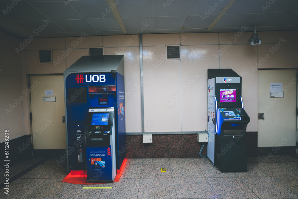 SINGAPORE - JULY 30, 2022 : ATMs (Automated Teller Machines) UOB and SAM at MRT Raffles station ...