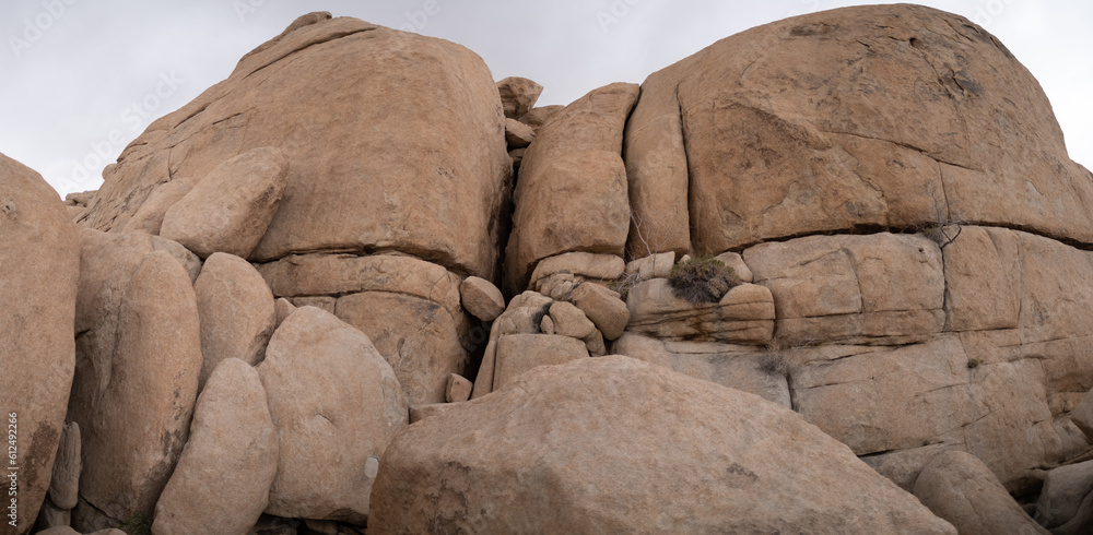 Boulders appear stacked in a natural rock formation in the Mojave ...