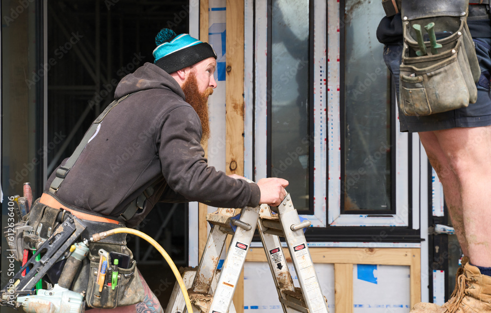Tradies at work on construction site Stock Photo | Adobe Stock