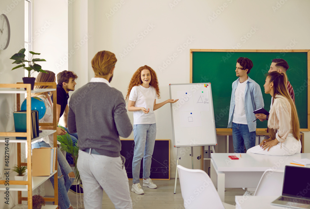 Student girl presenting her project in class. Group of school, college ...