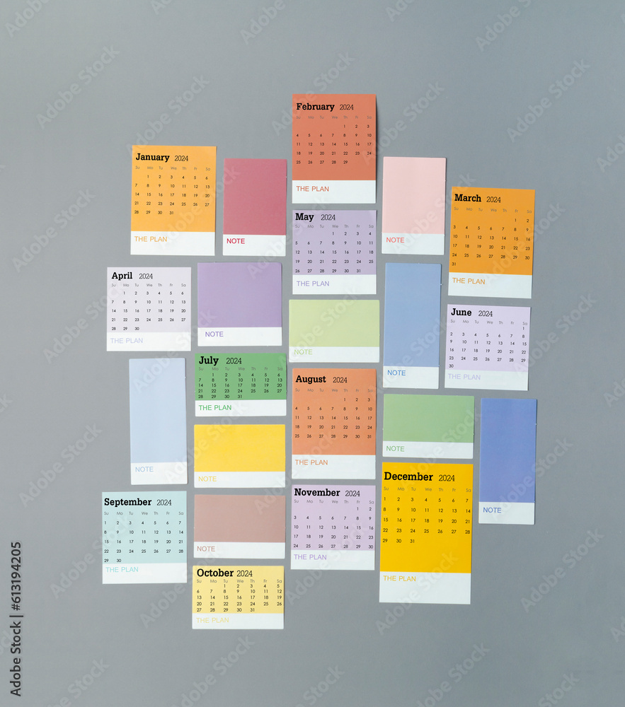 The calendar sheets with year 2024 and paper note on grey color ...