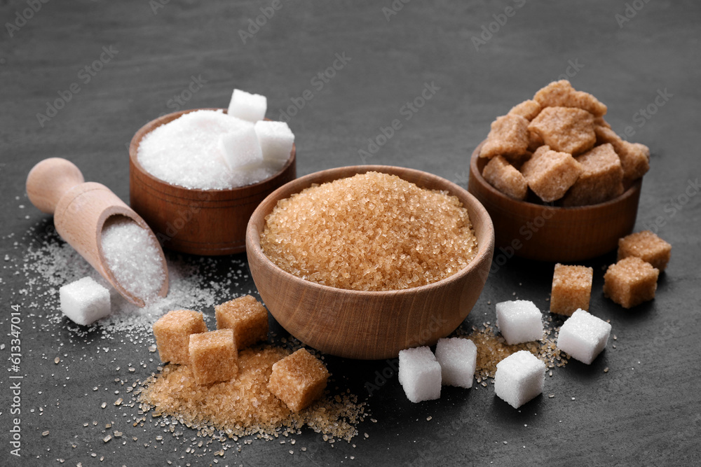 Different types of sugar on black table の Stock フォト | Adobe Stock