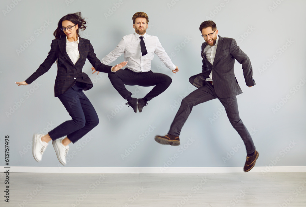 Team of crazy business people having fun in the office. Group of three ...