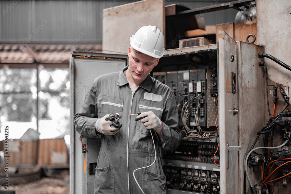 Electrical technician tests wiring, polarity, grounding, voltages and ...
