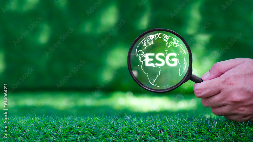 ESG concept of environmental, social and governance. Hand holding ...