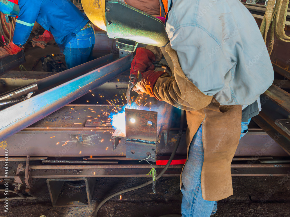 Stock-Foto „Welder welding a steel plate for steel structure work with ...