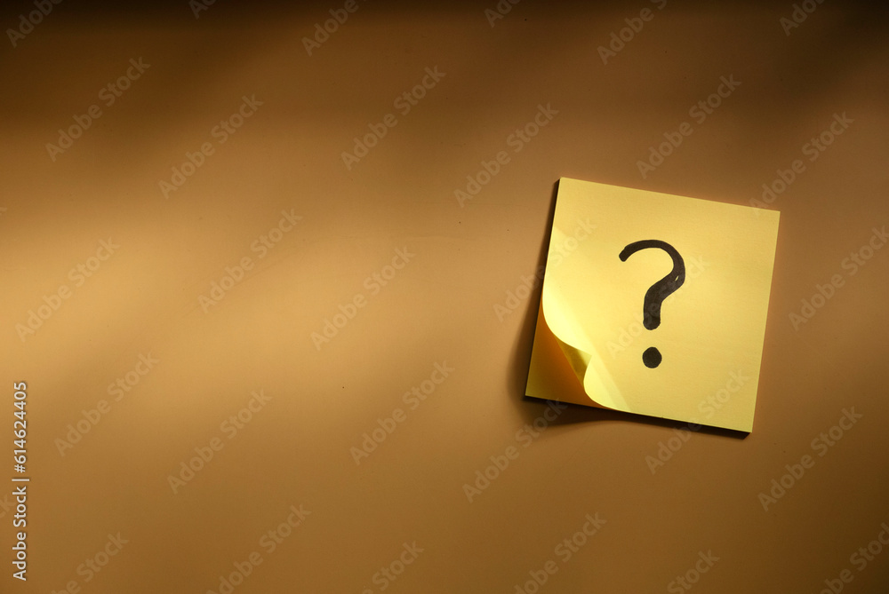 Questions and answer concept. Question mark written on paper. Brown ...