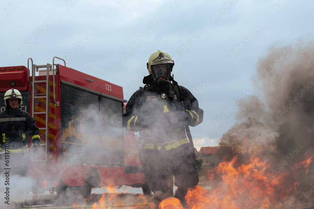 Firefighters using water fog type fire extinguisher to fighting with ...