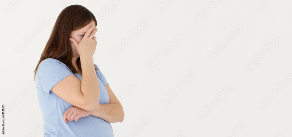 Embarrassed annoyed adult pregnant woman hiding face bend head down ...