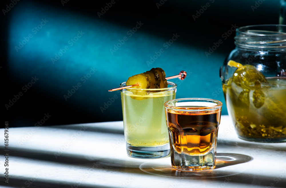 Pickleback, alcoholic cocktail drink from cucumber pickle and whiskey ...