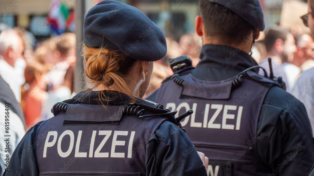 German police officers on duty on the street. ("POLICE" in German ...