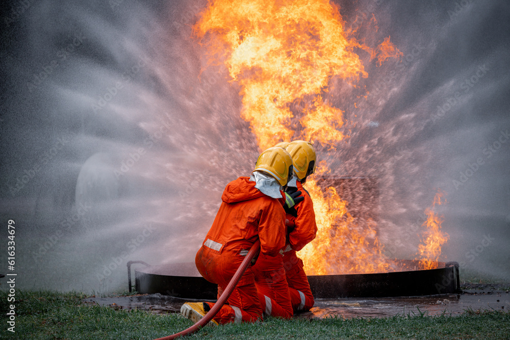 Стоковое фото «Firefighters safety using twirl water fog type fire ...