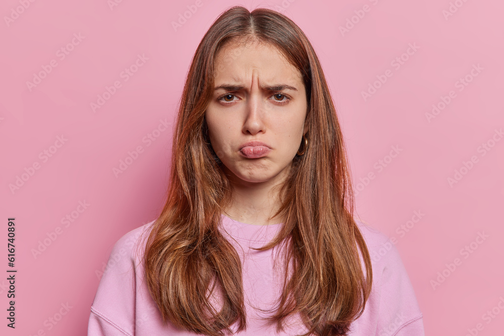 Displeased young European woman smirking face reveals deep mistrust as ...