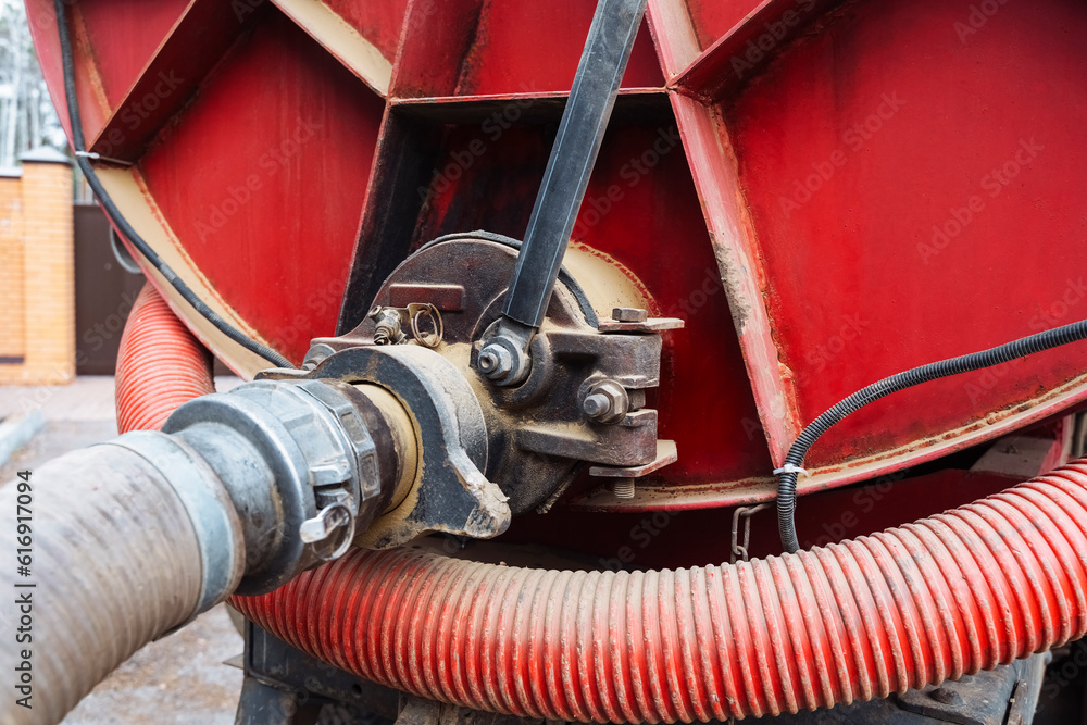 flange fitting connects a suction hose to a sewage tanker truck. Septic ...