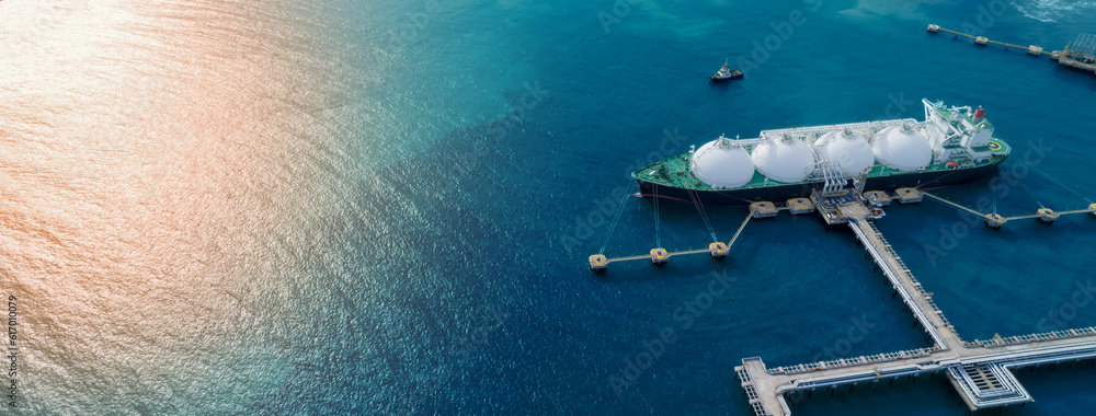 LNG (Liquified Natural Gas) tanker anchored in Gas terminal gas tanks ...