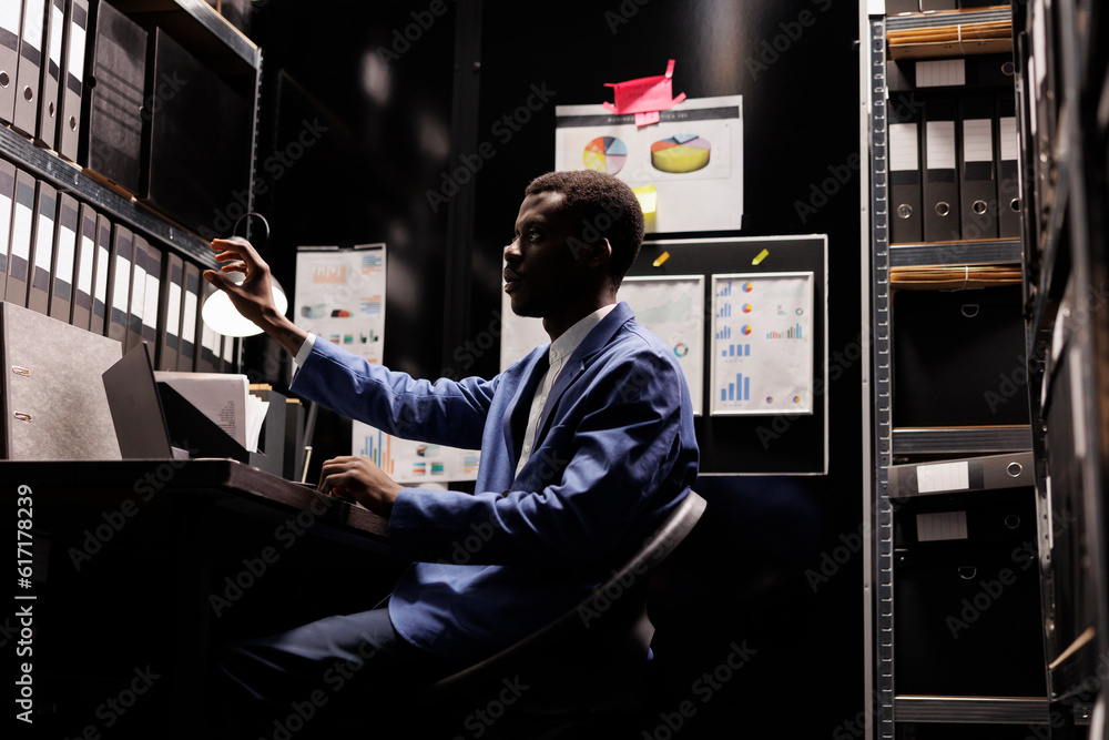 African american police officer using innovative technology to solve ...