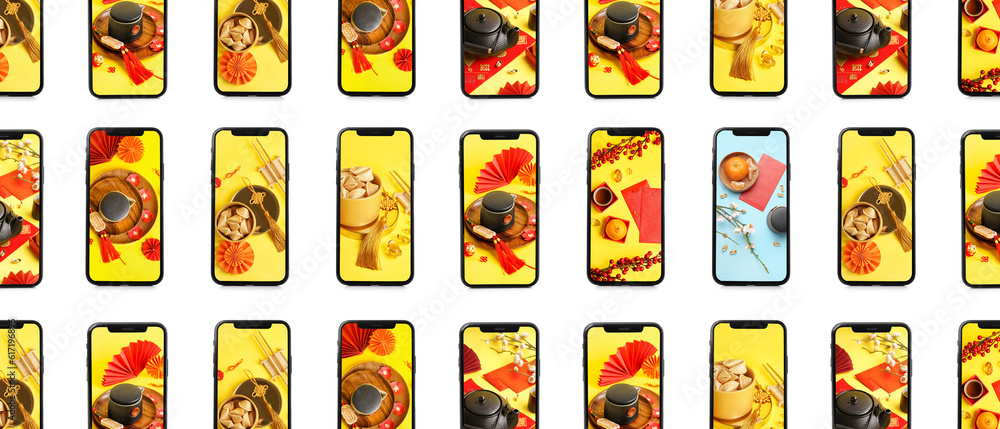 Many mobile phones with Chinese wallpapers on screens against white ...