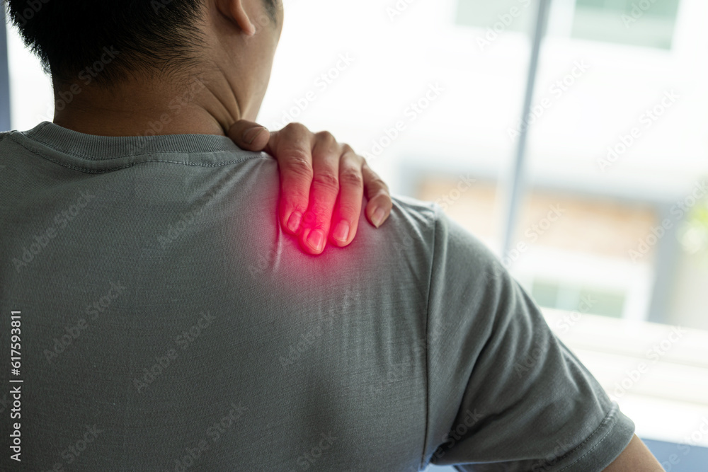 Close-up of shoulder pain from office syndrome, asian man touching neck ...