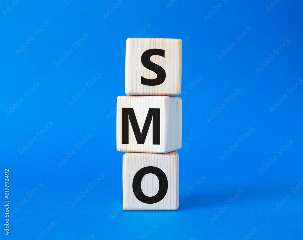 SMO - Social Media Optimization symbol. Wooden blocks with words SMO ...