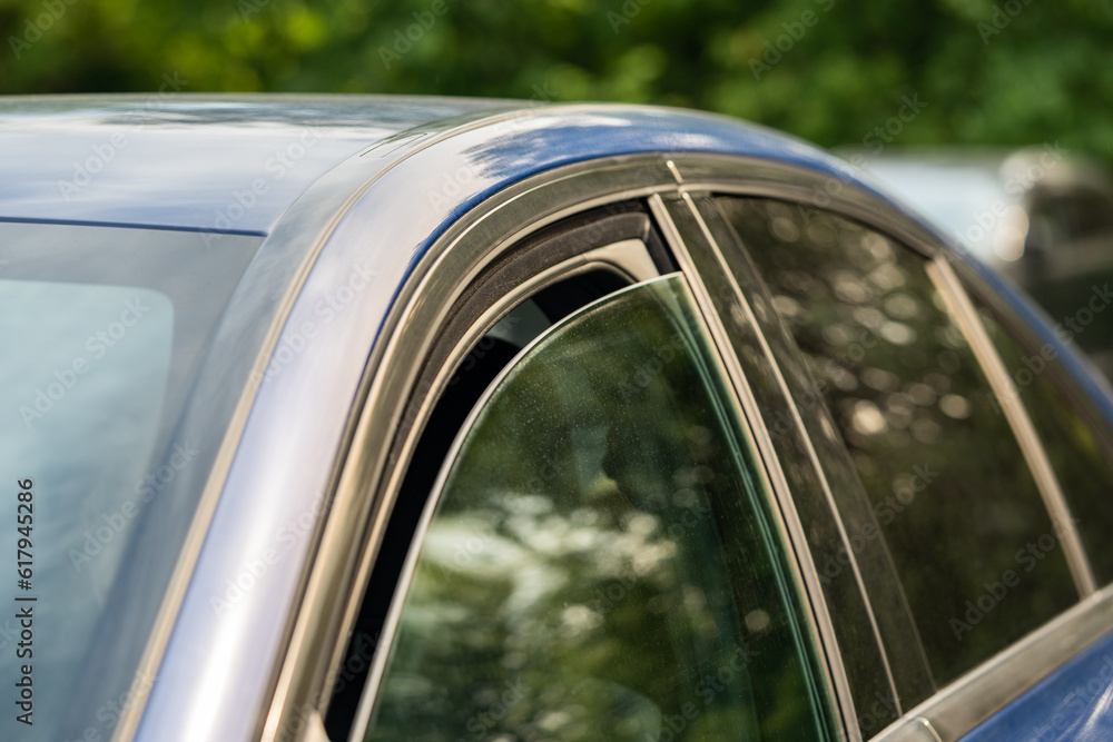 Heat, high temperature concept. Closeup of slightly ajar car window for ...