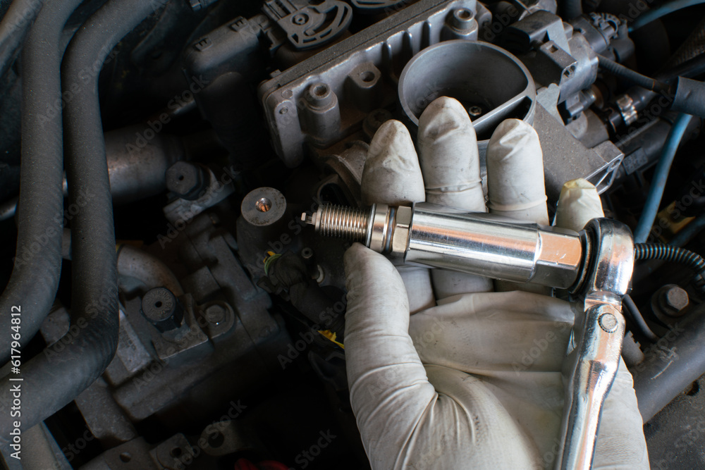 car maintenance, spark plug change operation of the combustion engine ...