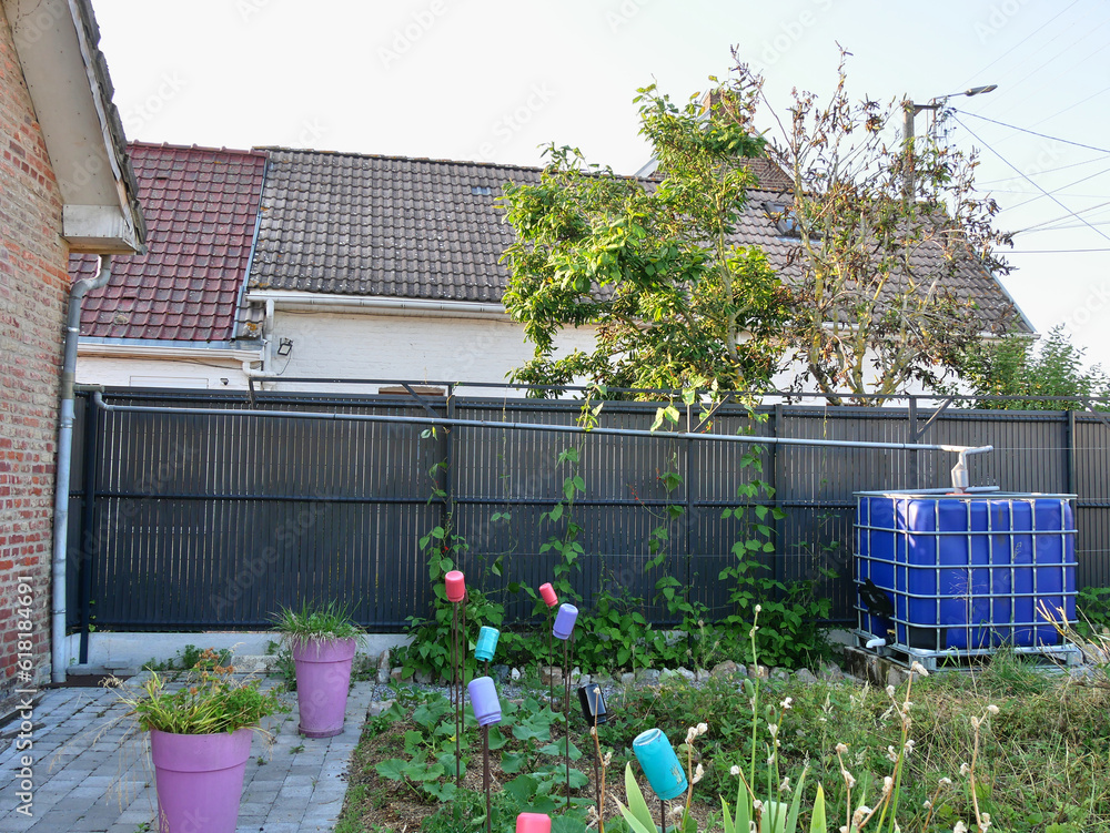 Rainwater collection system : overall view with gutter, pvc pipes and ...