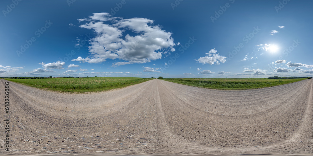 360 hdri panorama on gravel road with clouds and sun on blue sky in ...