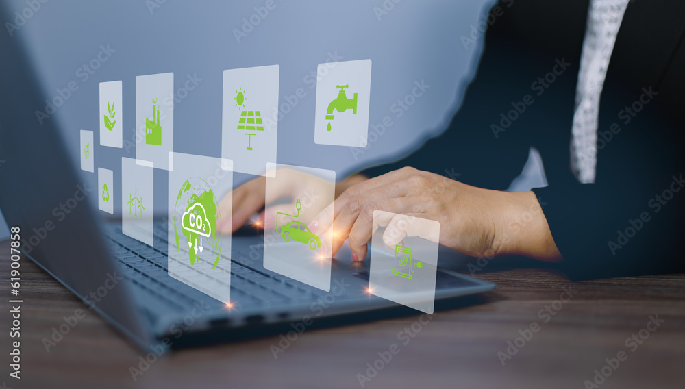 Foto Reduce CO2 emission concept. Businessman using laptop for working ...