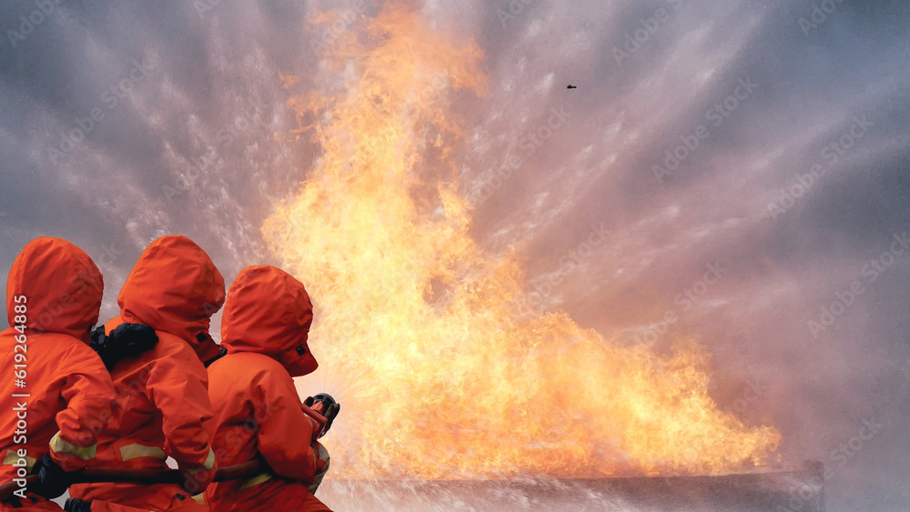 Firefighter Rescue team training in fire fighting extinguisher ...
