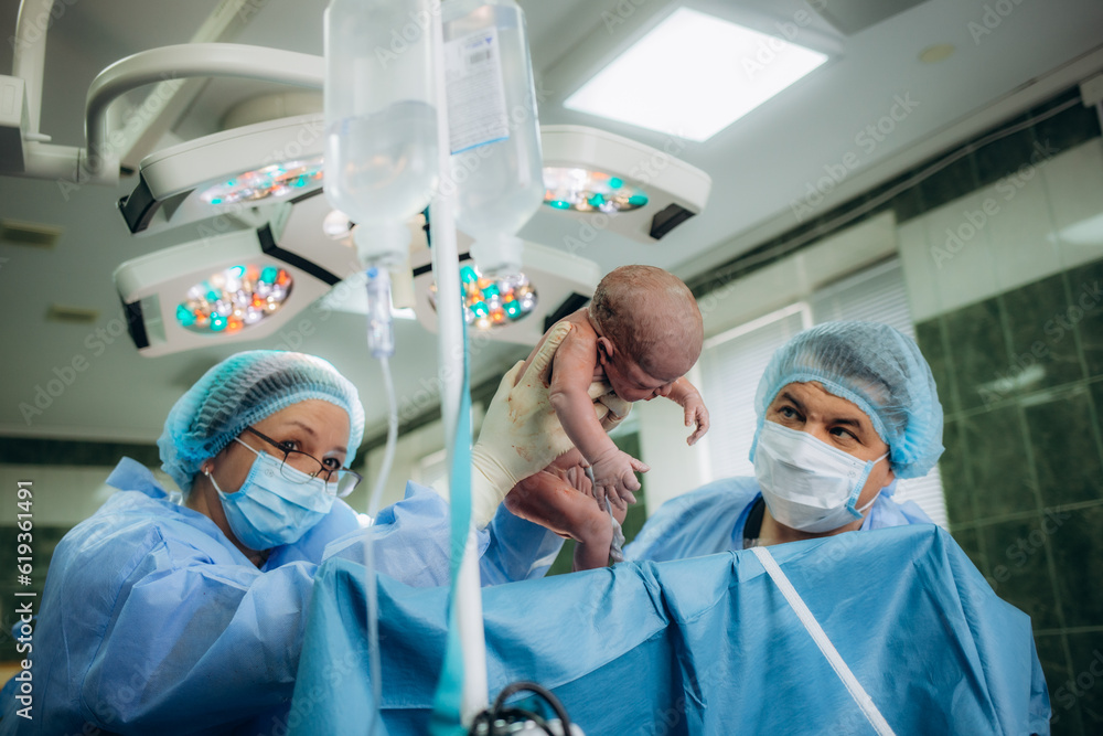 Doctor surgery team in the operating room of abdominal cesarean section ...