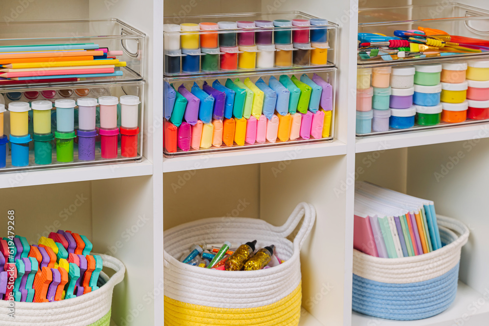 White shelving with various material for creativity and kids art ...