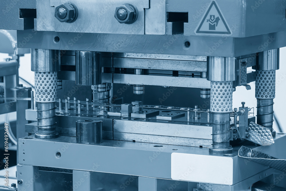 Closeup scene of the progressive die operation in the light blue scene ...