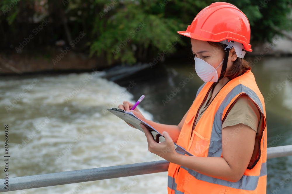 Asian Female engineering working . at sewage treatment plant,Marine ...