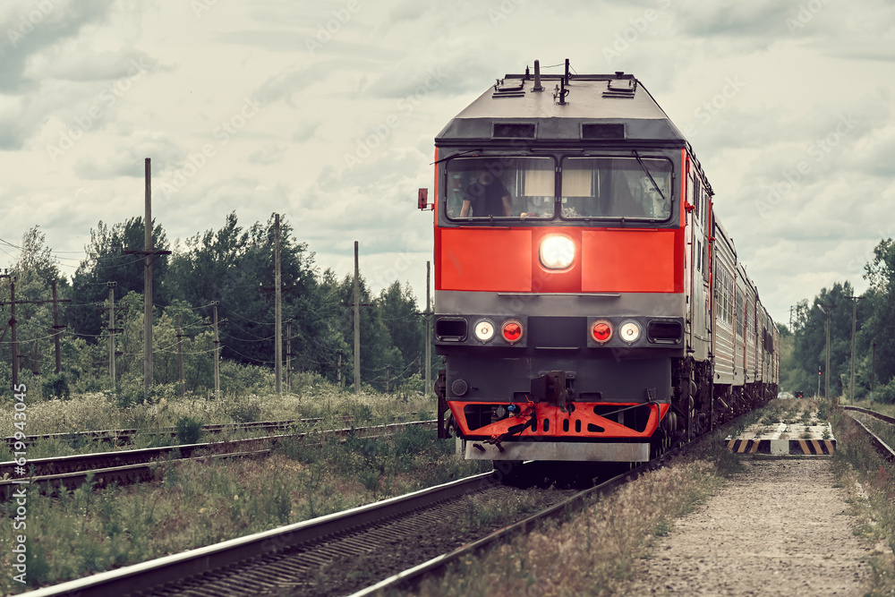 Soviet passenger train rides on rails through the forest. Russian ...