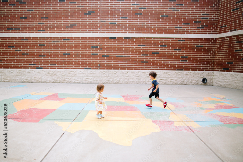 Children run around on map of united states Stock Photo | Adobe Stock