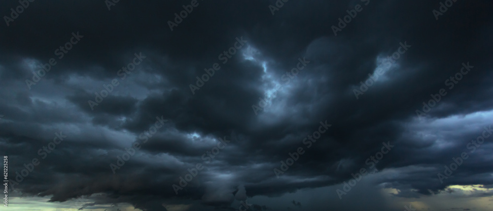The dark sky with heavy clouds converging and a violent storm before ...