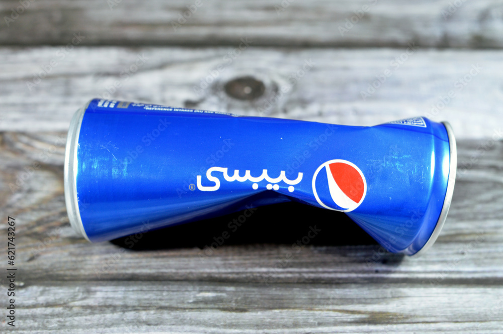Cairo, Egypt, June 24 2023: Crushed Pepsi can, Cola flavor plastic ...