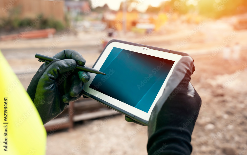 Site engineer surveyor using rugged tablet controller computer to ...