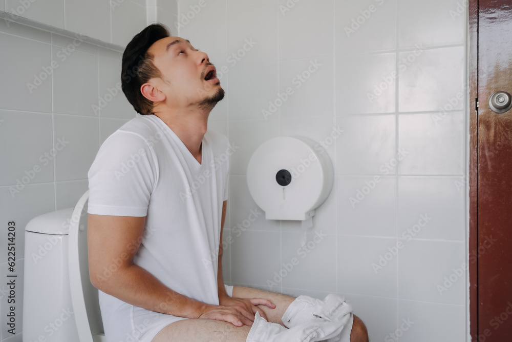 Funny happy face of asian man able to poop after suffer from ...