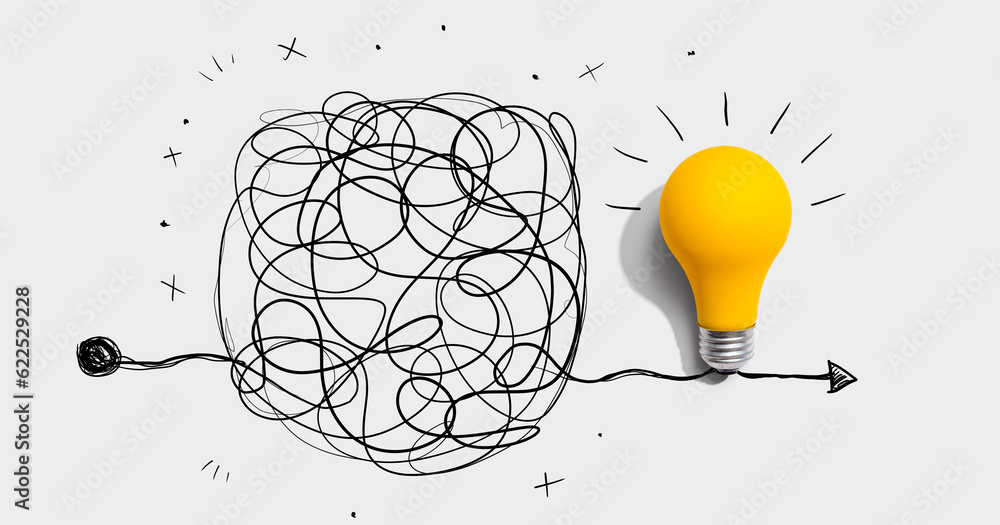 Clarifying complex ideas theme with light bulb - Flat lay Stock Photo ...