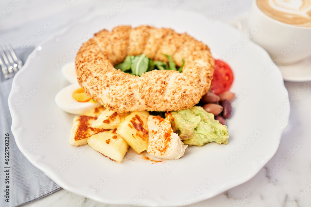 Turkish breakfast with simit, cheese, tomato, cucumber, olives ...