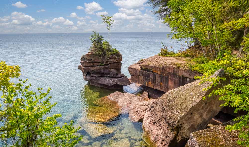 Rocky coastline of Lake Superior in Big Bay State Park in La Pointe on ...