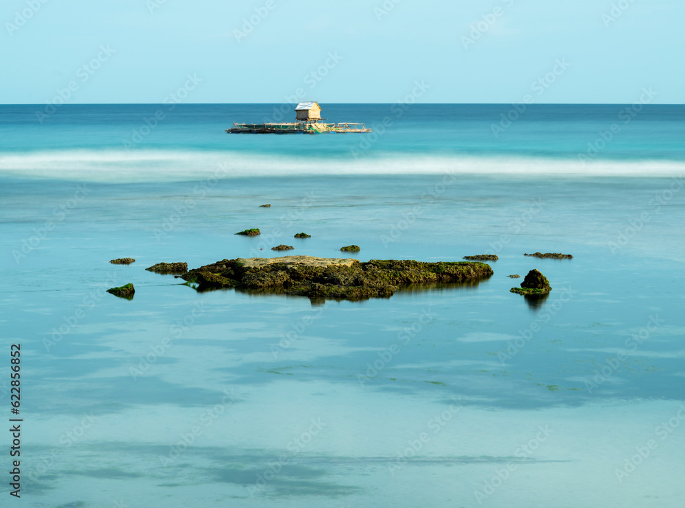 Fisherman's hut,floating out at sea on a bamboo platform,and smooth ...